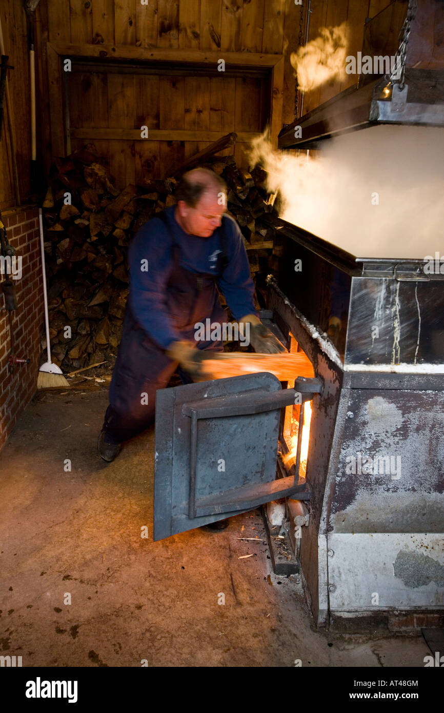 Tending to the fire hi-res stock photography and images - Alamy