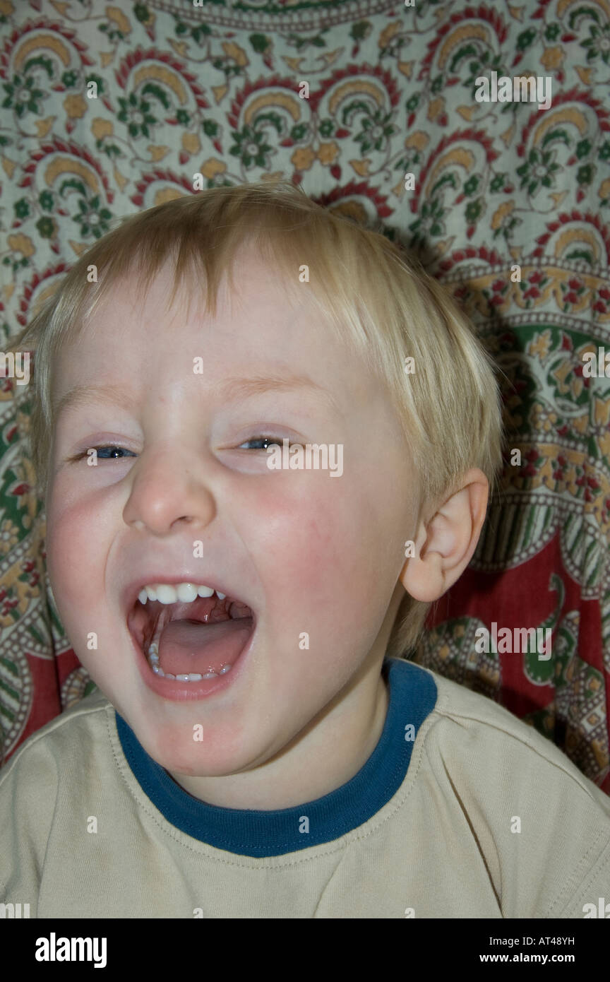 Small boy laughing Stock Photo - Alamy