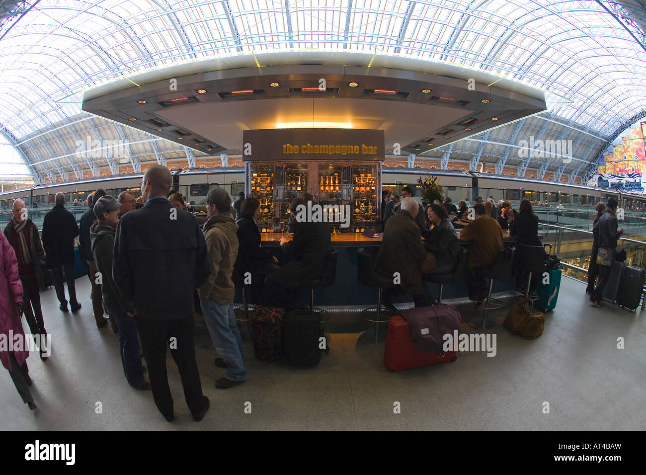 Travellers passengers relax at the longest champagne bar in Europe at ...