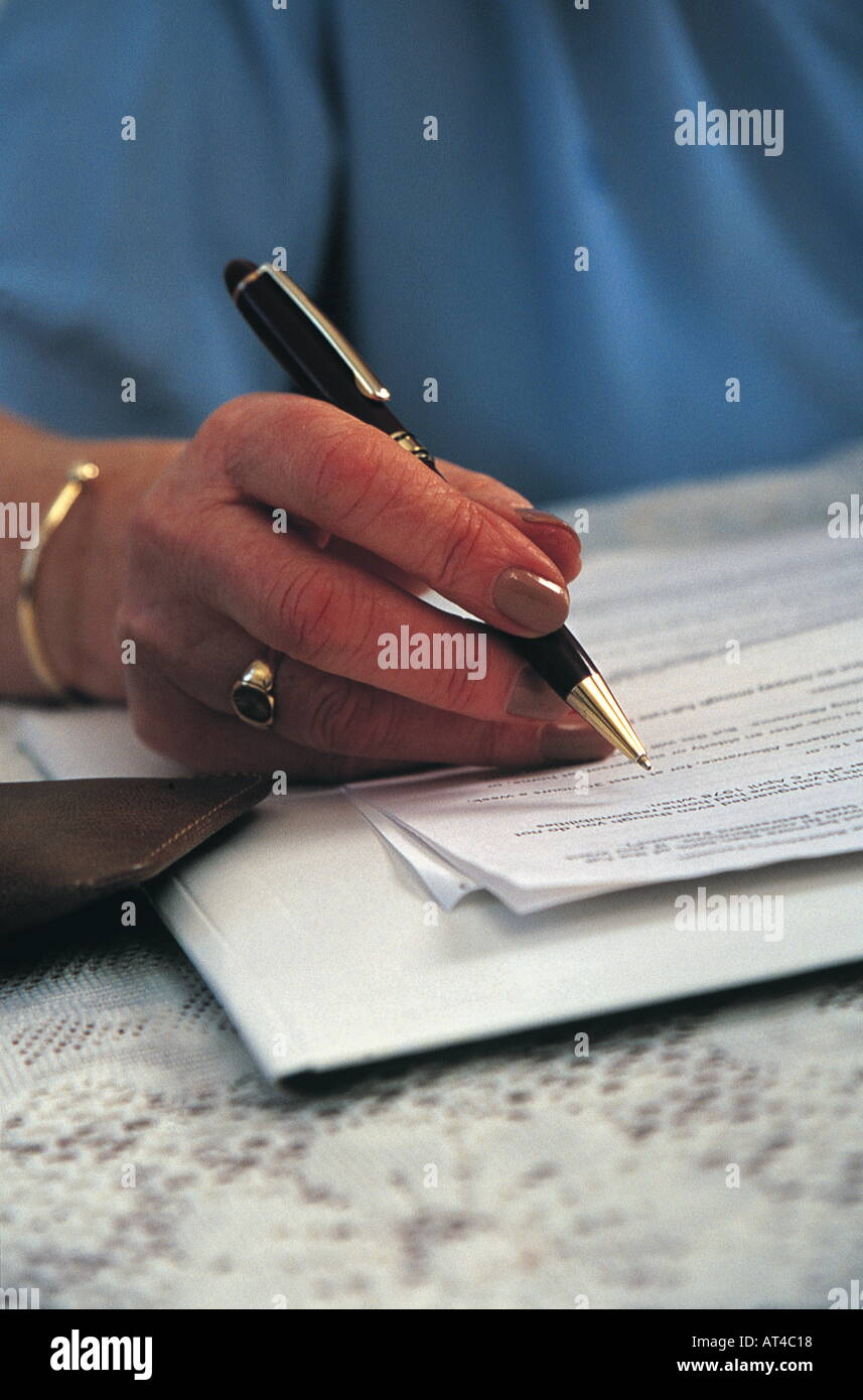 woman making notes Stock Photo - Alamy