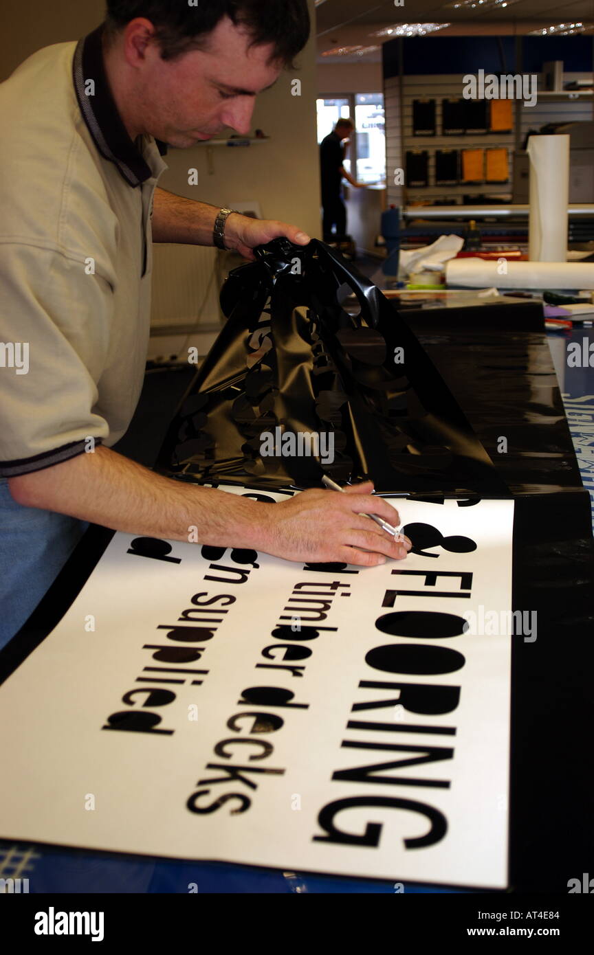 man making a poster Stock Photo - Alamy