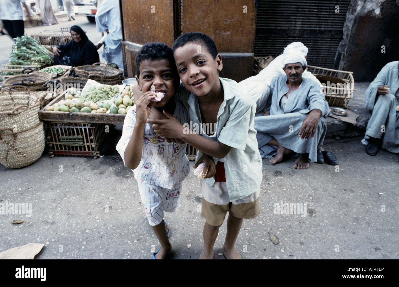 Two small Egyptian boys pose for the camera in the street in Luxor ...