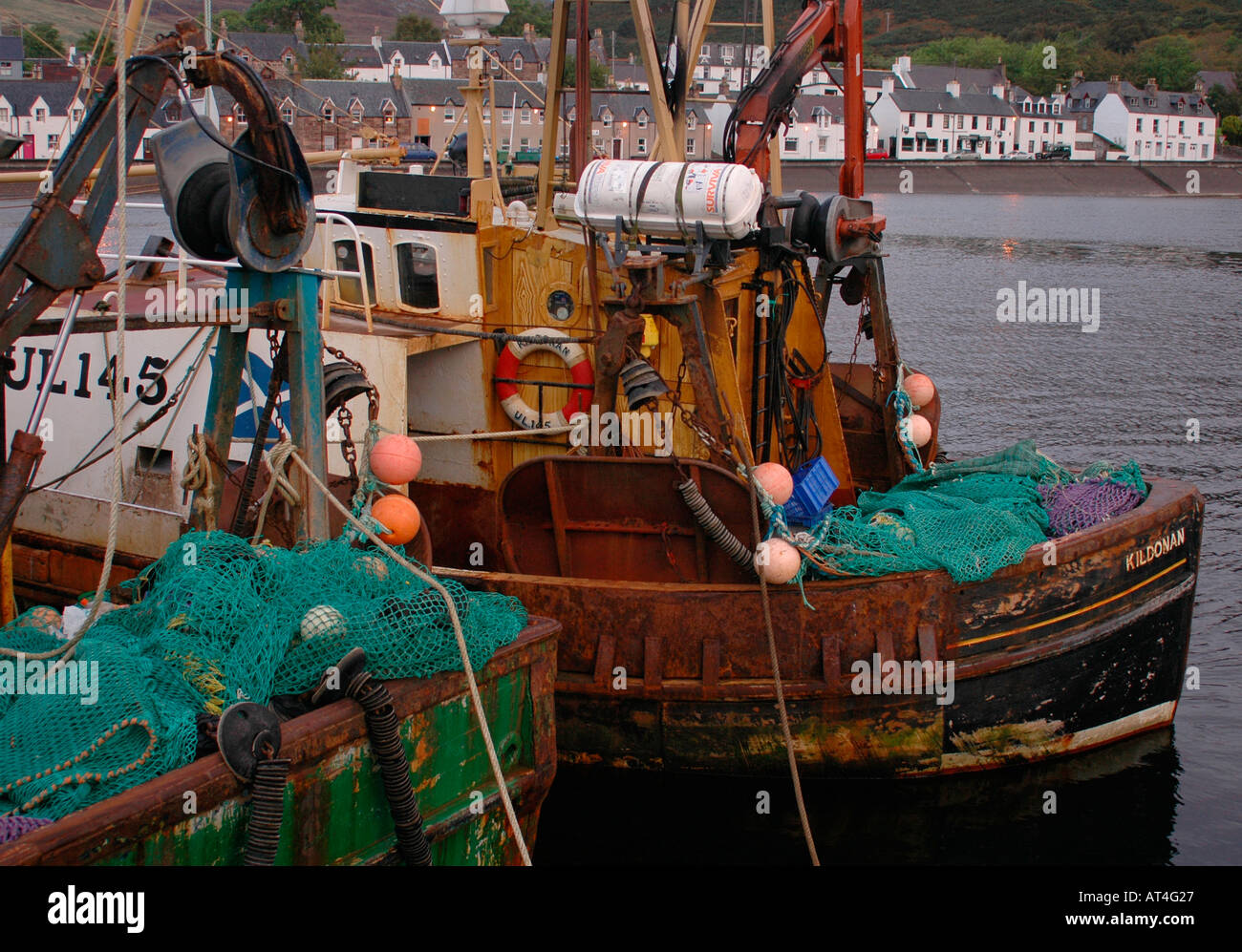 Fishing boats tied up to the pier in Ullapool harbour Stock Photo - Alamy
