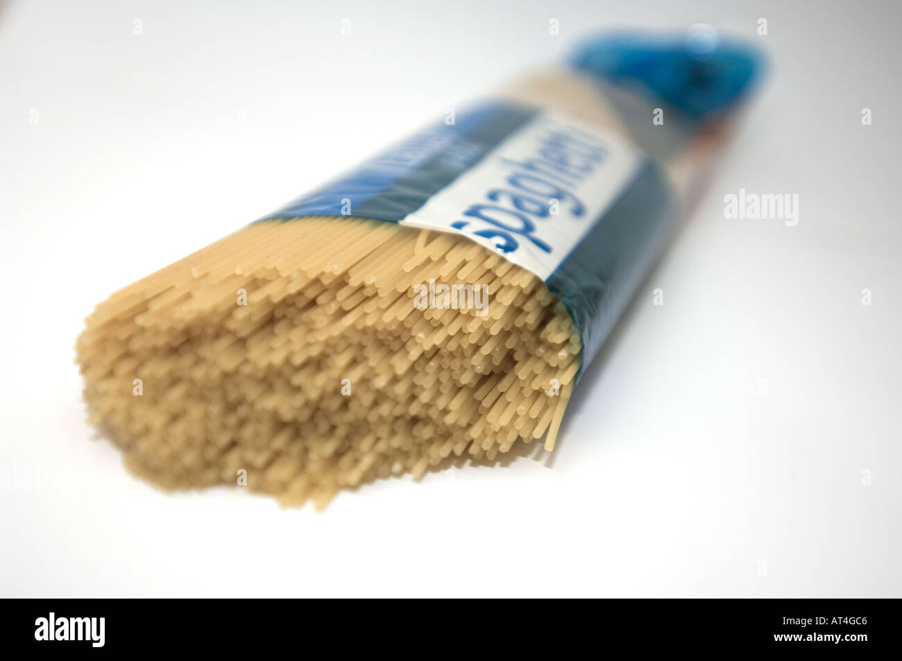 Pasta spilling out of a packet Stock Photo - Alamy