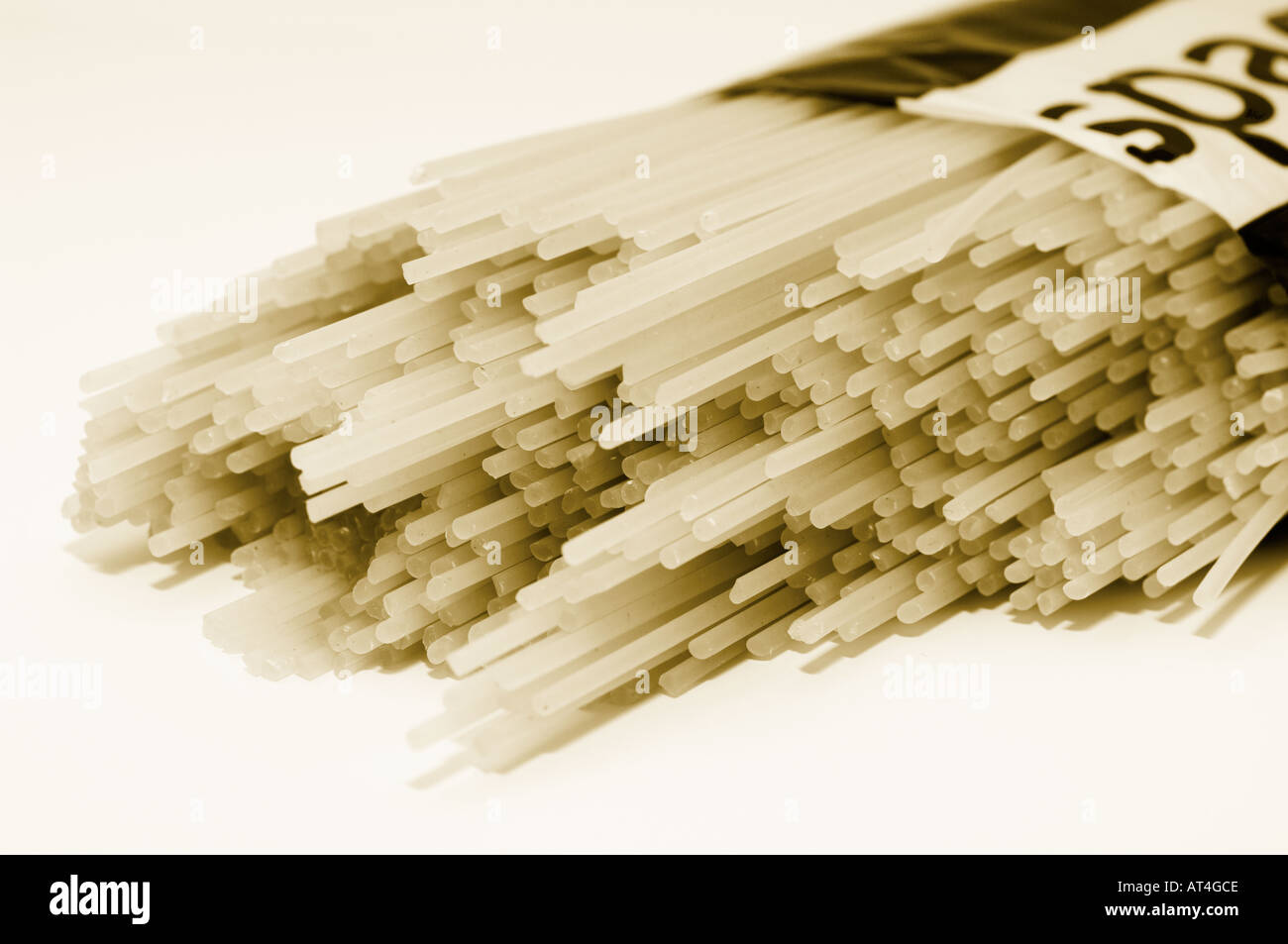 Pasta spilling out of a packet Stock Photo - Alamy