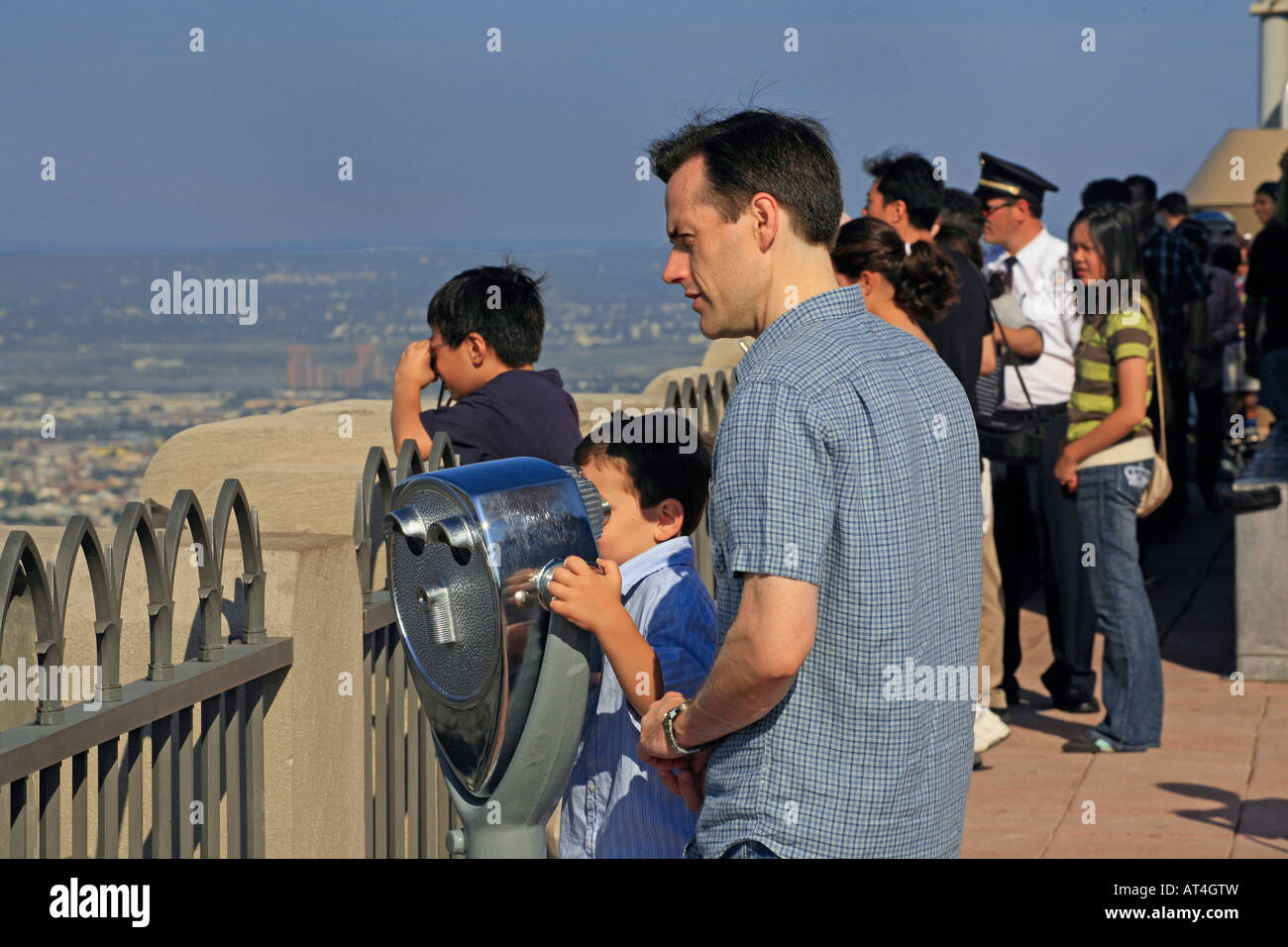 Families using the viewing station from TOP OF THE ROCK ROCKEFELLER ...