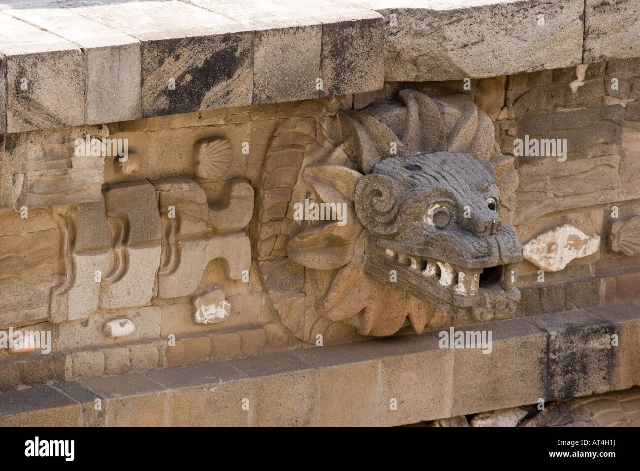 Quetzalcoatl (feathered serpent) head sculpture carving in its temple ...
