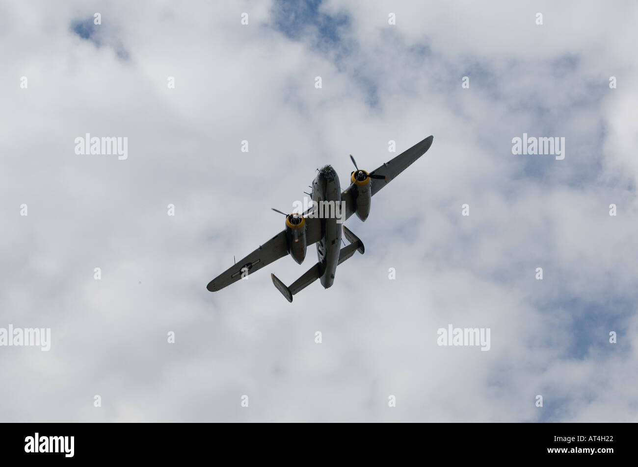 World War II airplane flying over crowd at air show Stock Photo - Alamy