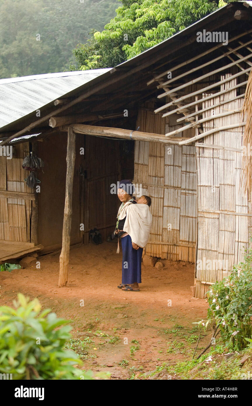 Parent carrying child on back village hi-res stock photography and ... Parent carrying child on back village hi-res stock photography and ...