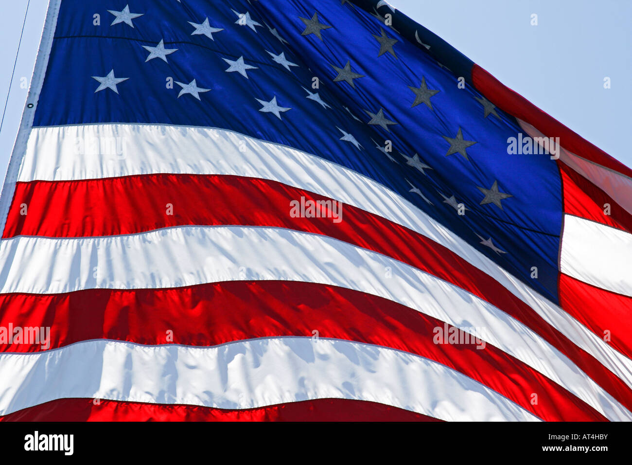 American flag billowing - blowing in the breeze Stock Photo - Alamy