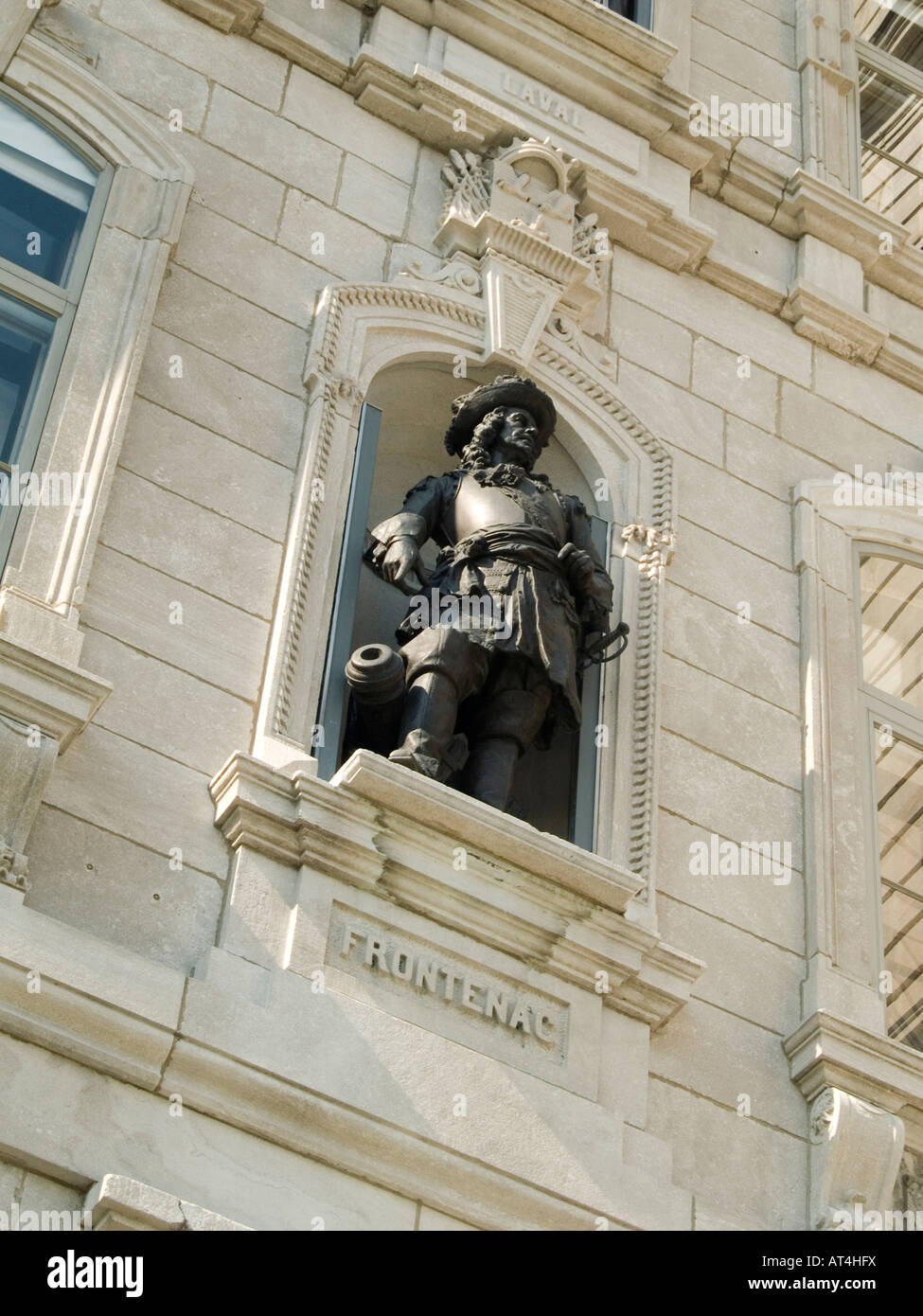 A bronze statue of Frontenac in a niche on the front of the Assemblee ...