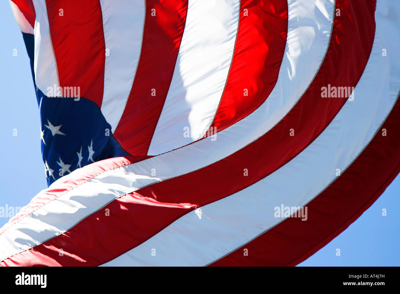 American flag billowing - blowing in the breeze Stock Photo - Alamy