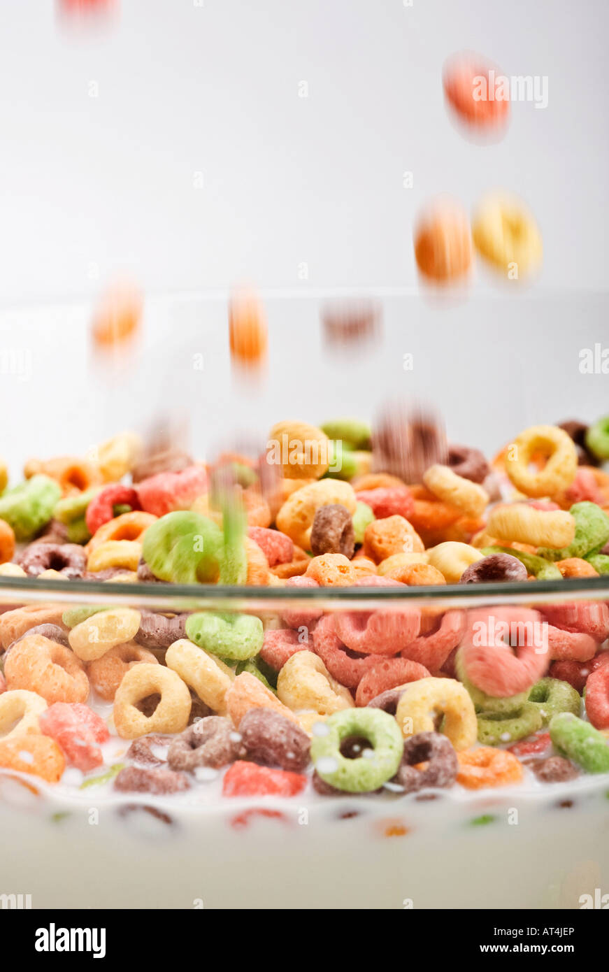 Cereal colorful rings Cheerios in glass bowl with a milk breakfast for ...