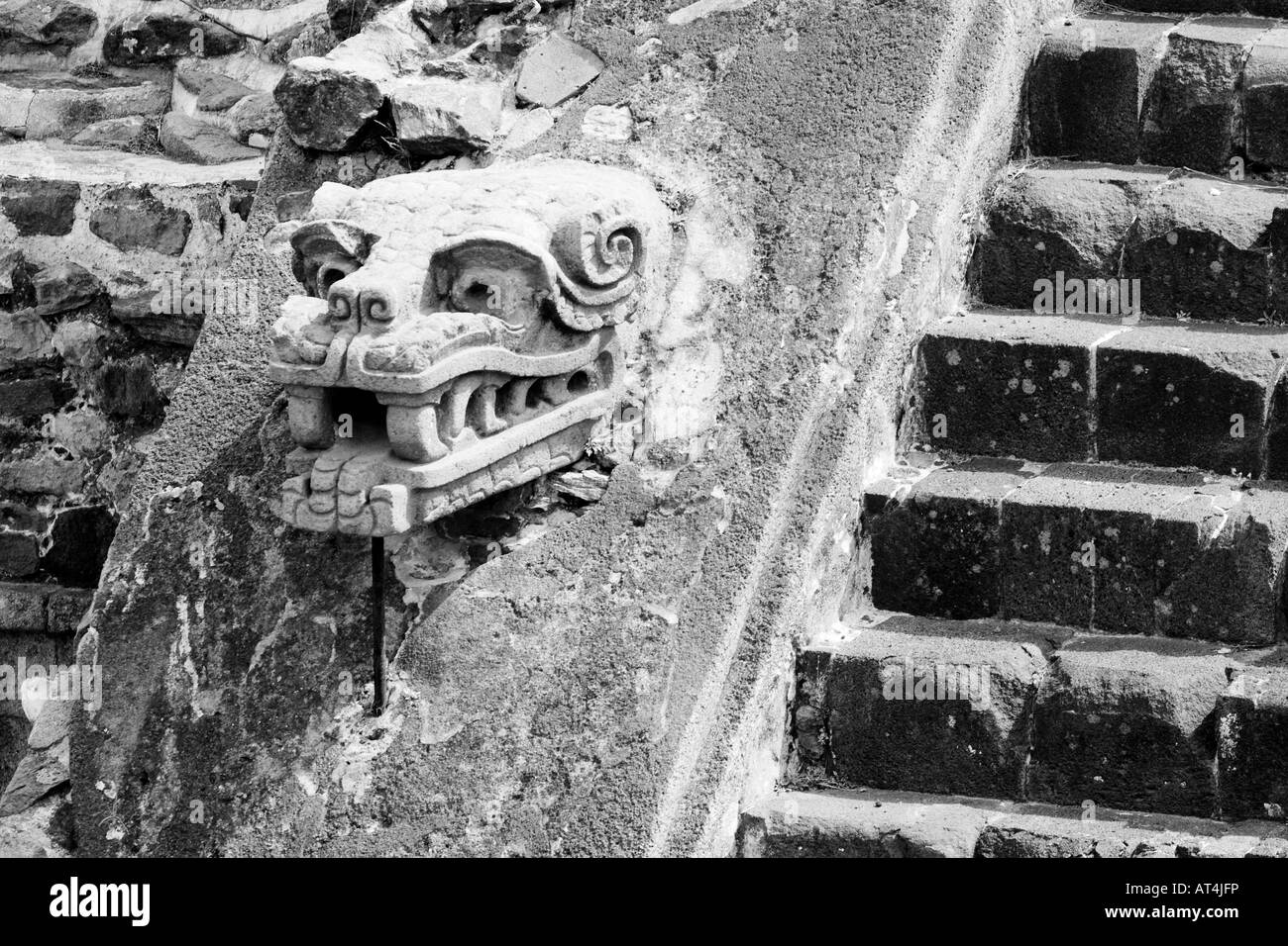 Quetzalcoatl (feathered serpent) head sculpture carving in its temple ...