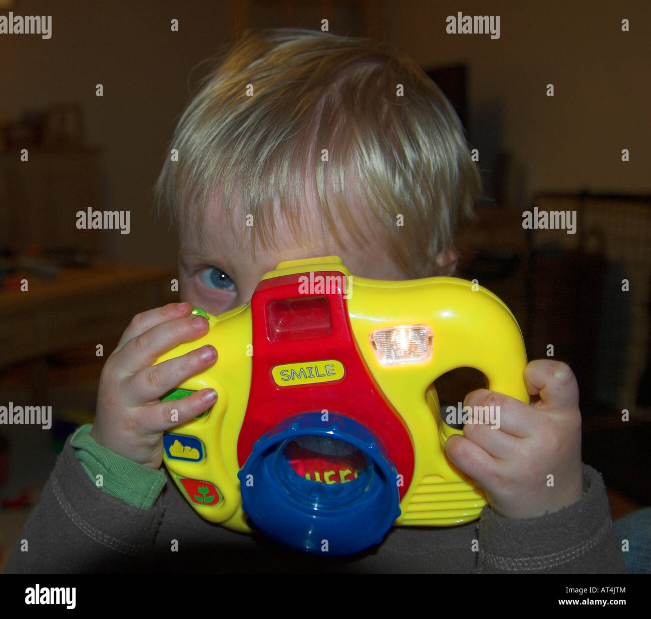 Boy playing with toy camera Stock Photo - Alamy