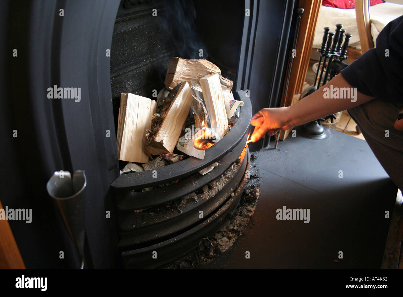 Lighting a fire Stock Photo - Alamy