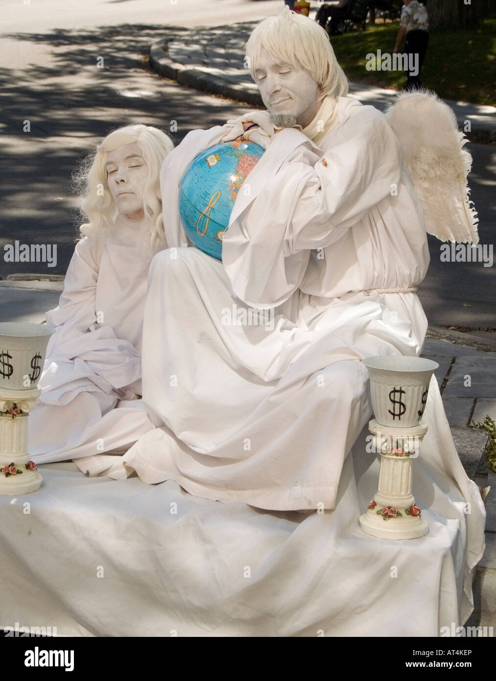 Two people dressed as angels in Place d'Armes in Quebec City, Canada ...