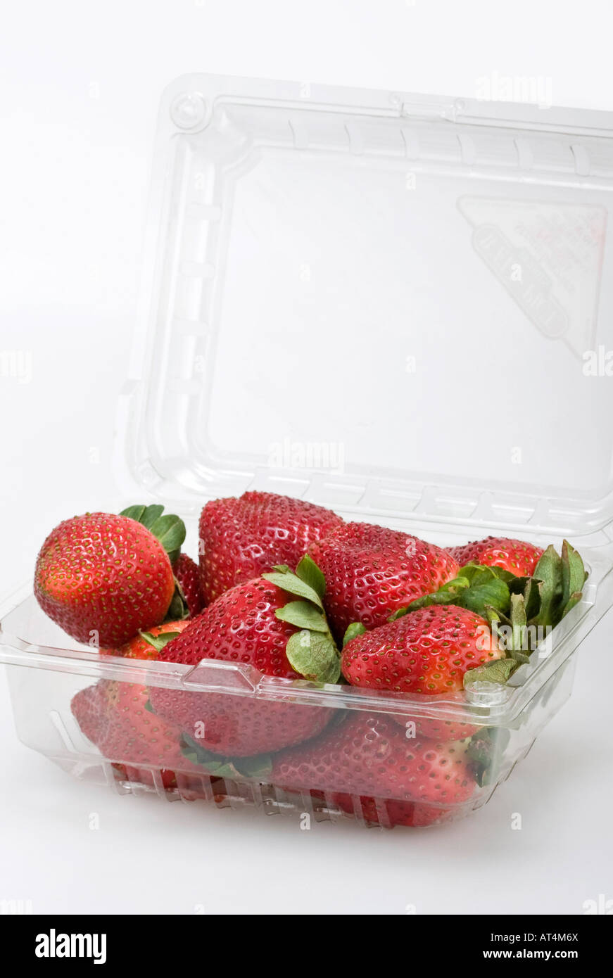 Strawberries fruit in plastic container selling at farmers market ...