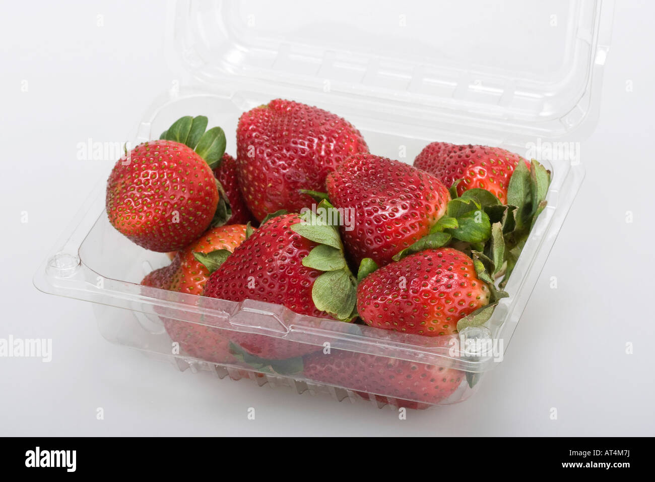 Strawberries fruit in plastic container selling at farmers market ...