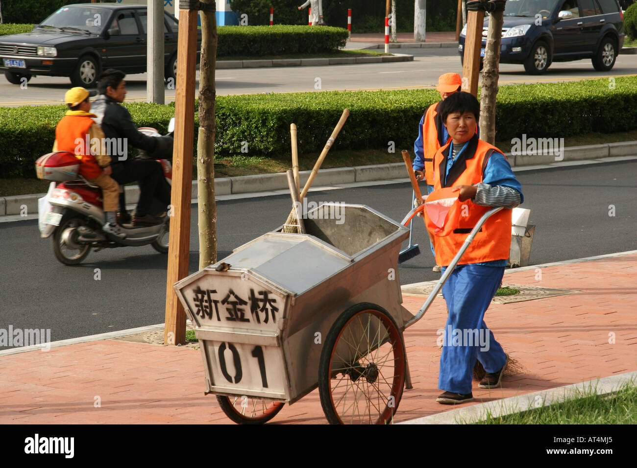 Street cleaner with traditional broom and push cart Stock Photo - Alamy