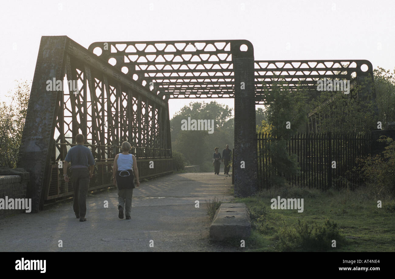 Walkers crossing bridge over River Avon on The Greenway path, Stratford ...
