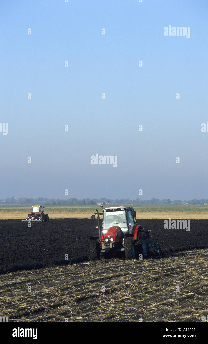 Massey Ferguson tractors ploughing and power harrowing field in The ...