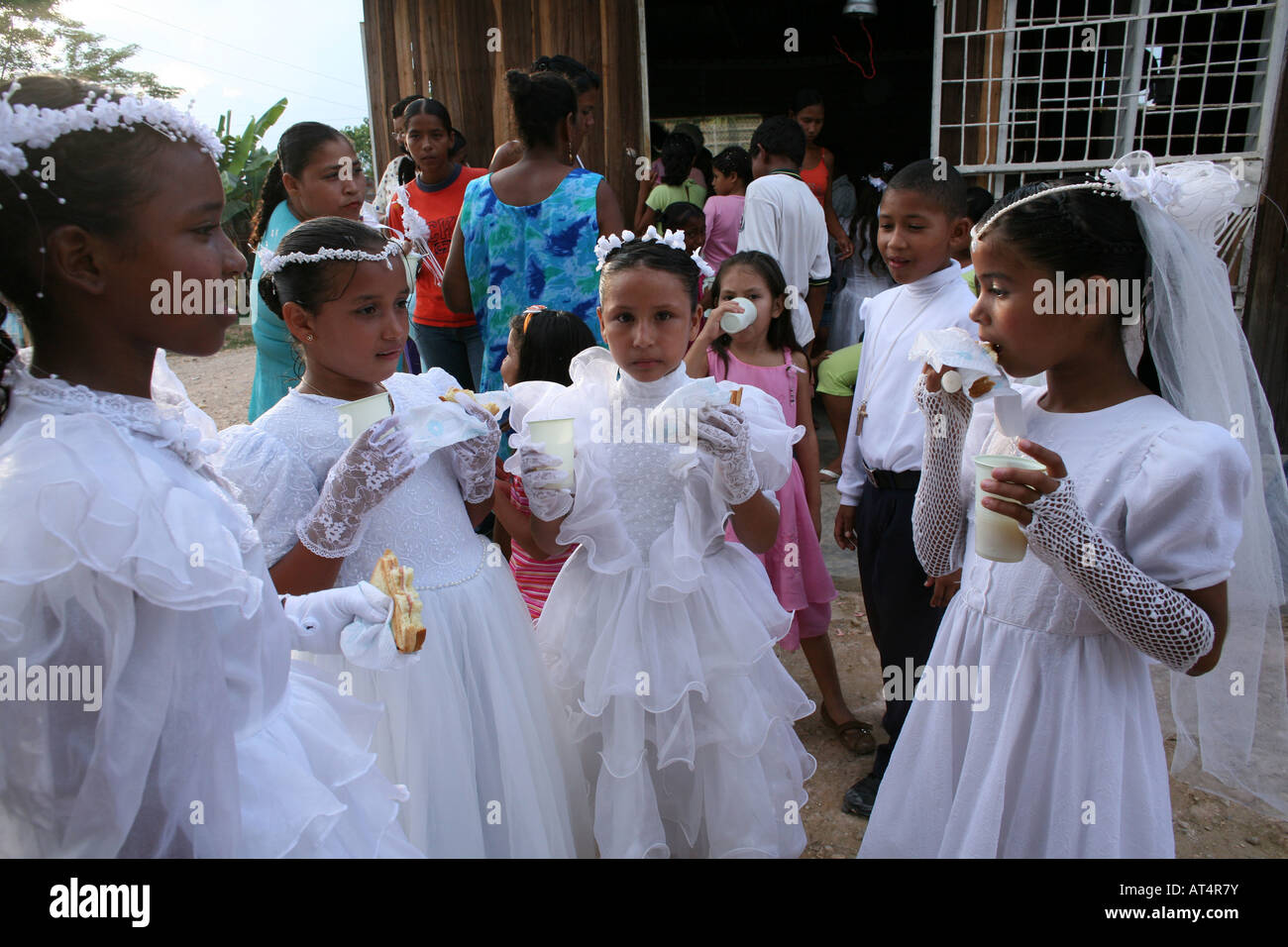 Children celebrate their first commune in the local slum church Stock ...
