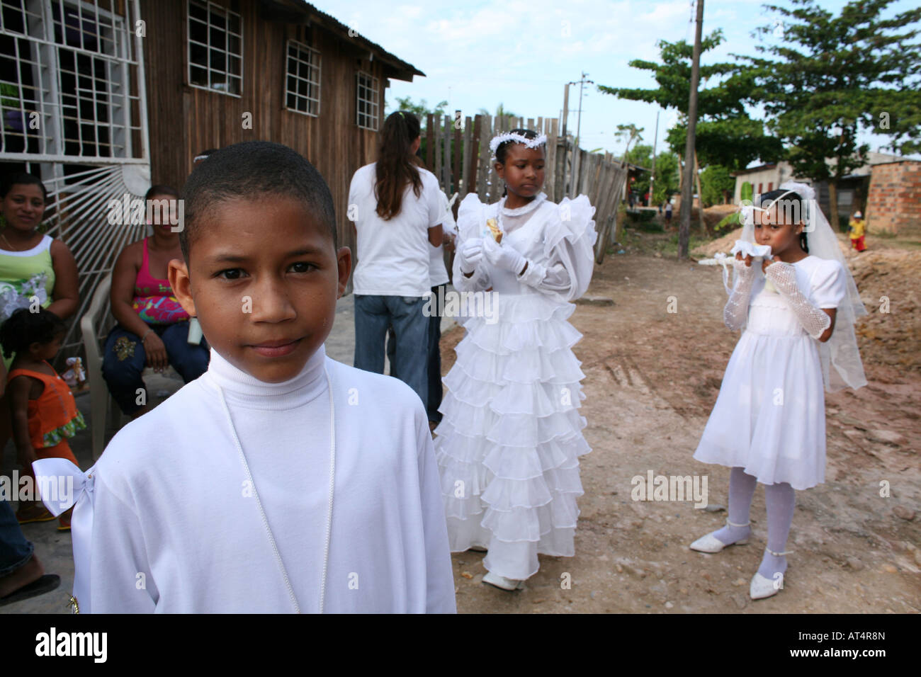 Children celebrate their first commune in the local slum church Stock ...