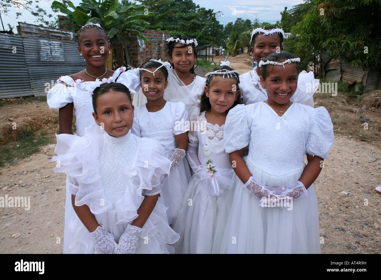 Children celebrate their first commune in the local slum church Stock ...