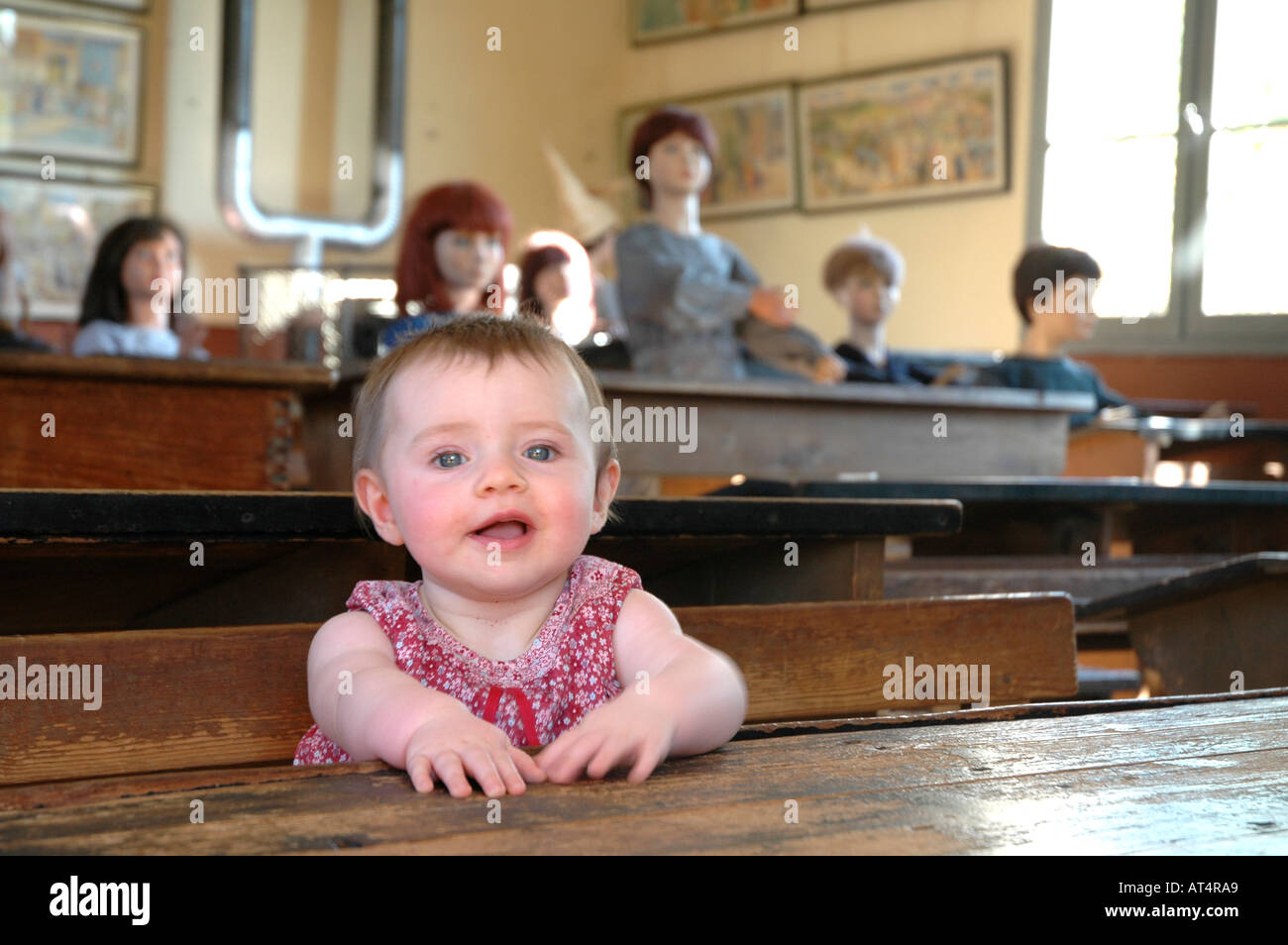 Baby in a classroom Stock Photo - Alamy