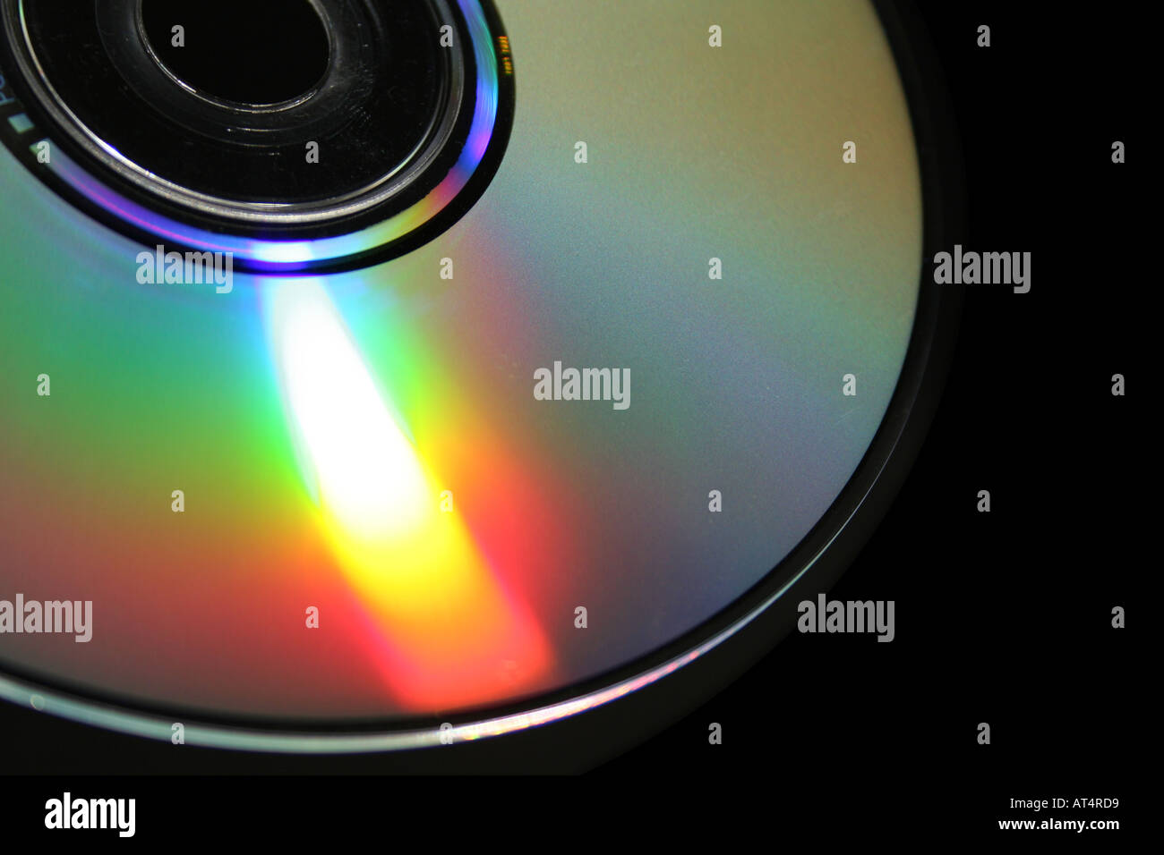 CD-ROM or DVD with rainbow reflections over a black background Stock ...