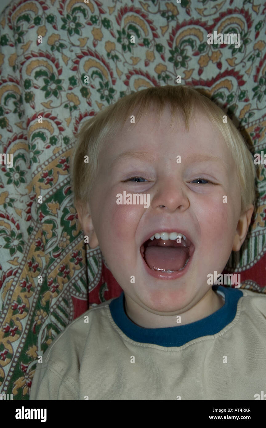 Small boy laughing Stock Photo - Alamy