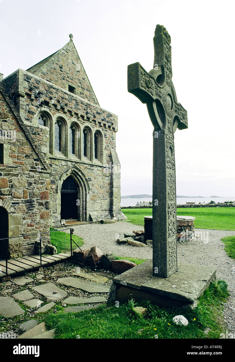 Iona Abbey and high cross on Celtic Christian island of Iona, founded ...