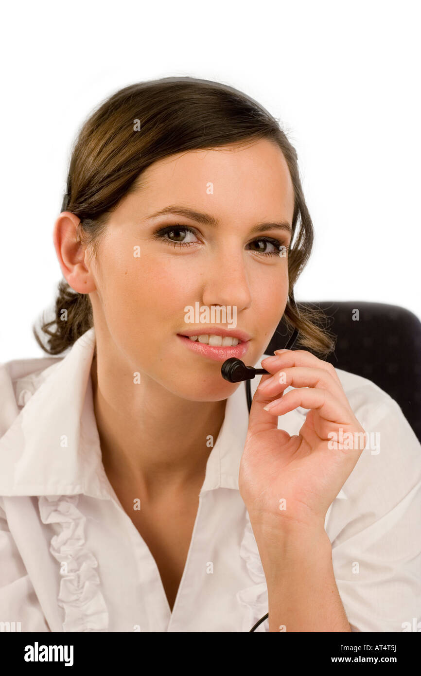 Attractive smiling young woman talking with headset Stock Photo - Alamy