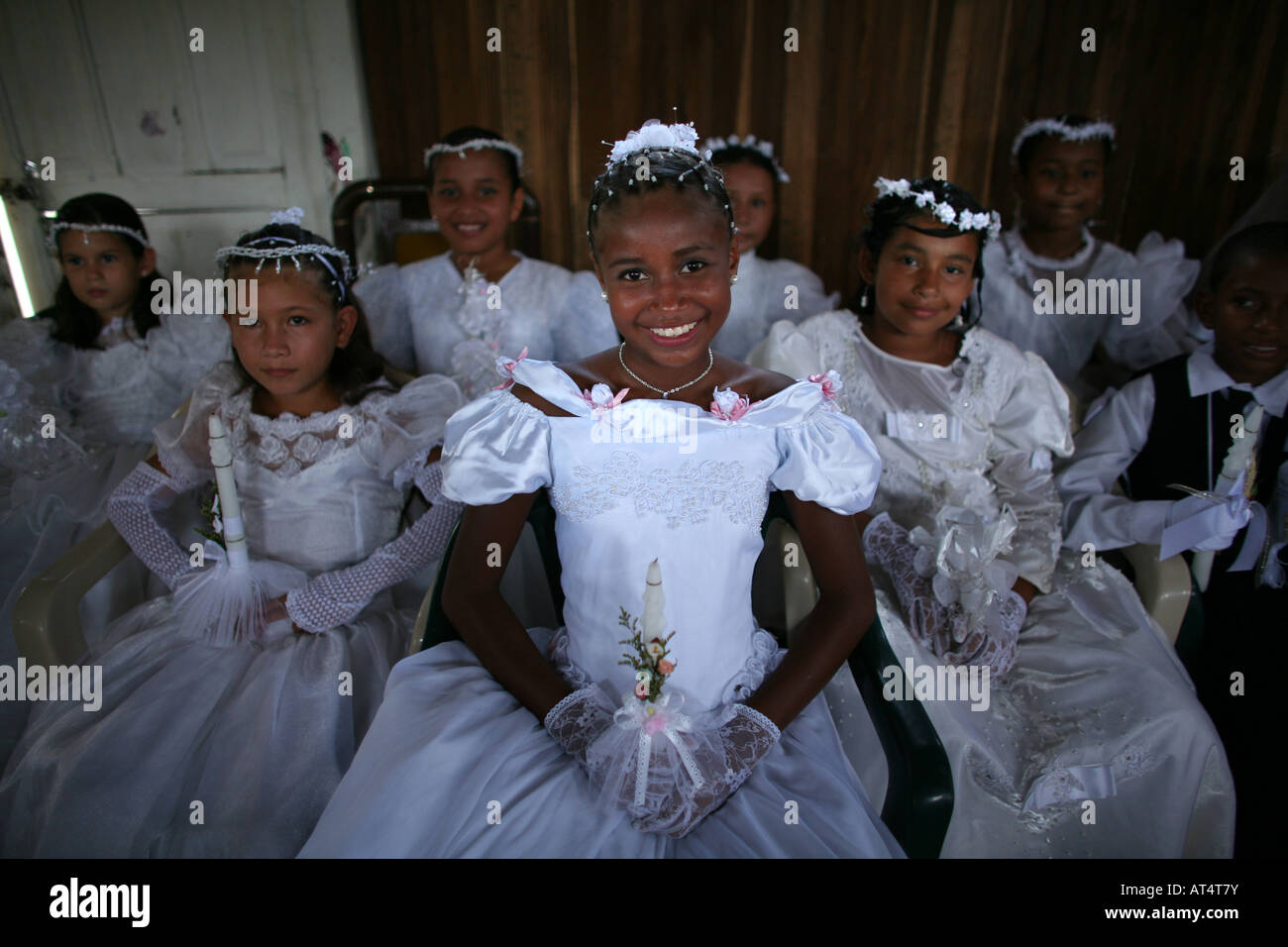 Children celebrate their first commune in the local slum church Stock ...