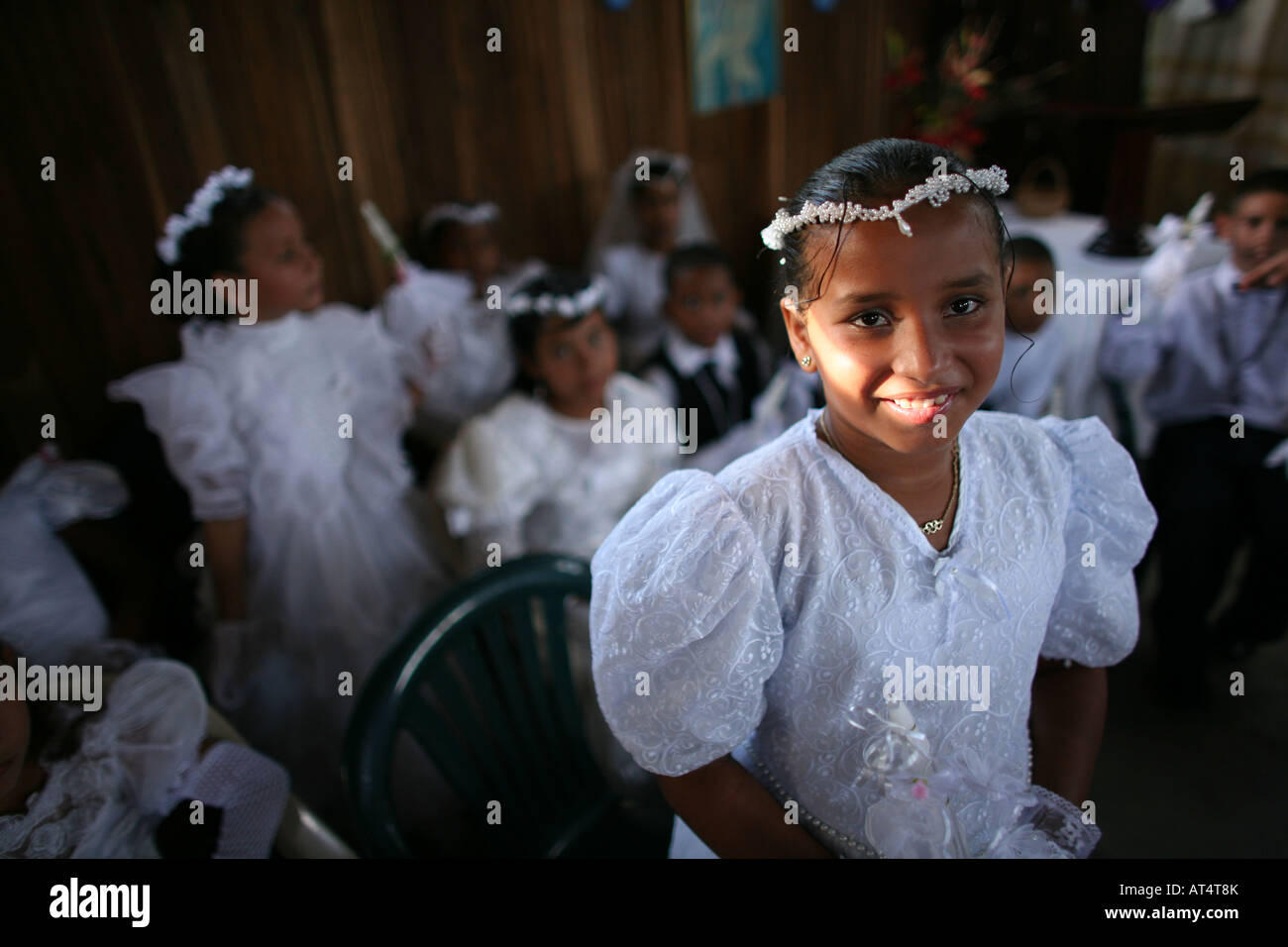 Children celebrate their first commune in the local slum church Stock ...