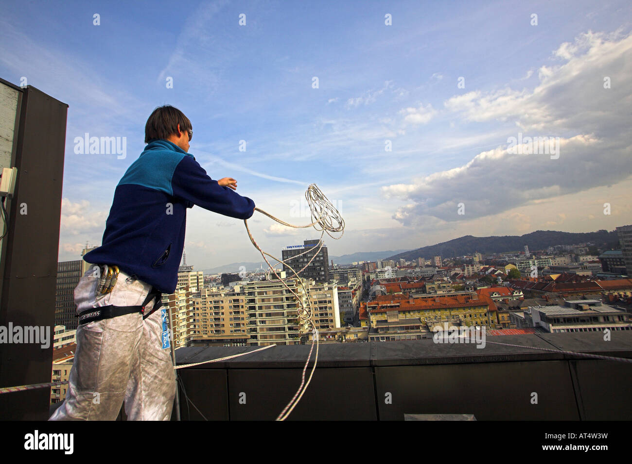 Vertical worker preparing for window cleaning on high skyscraper Stock ...