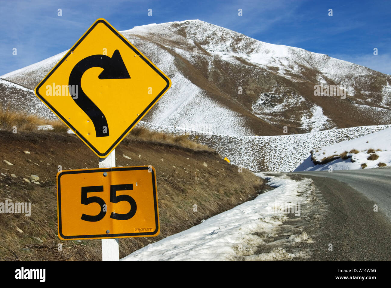 A roadside sign indicating the recommended speed to negotiate a corner ...