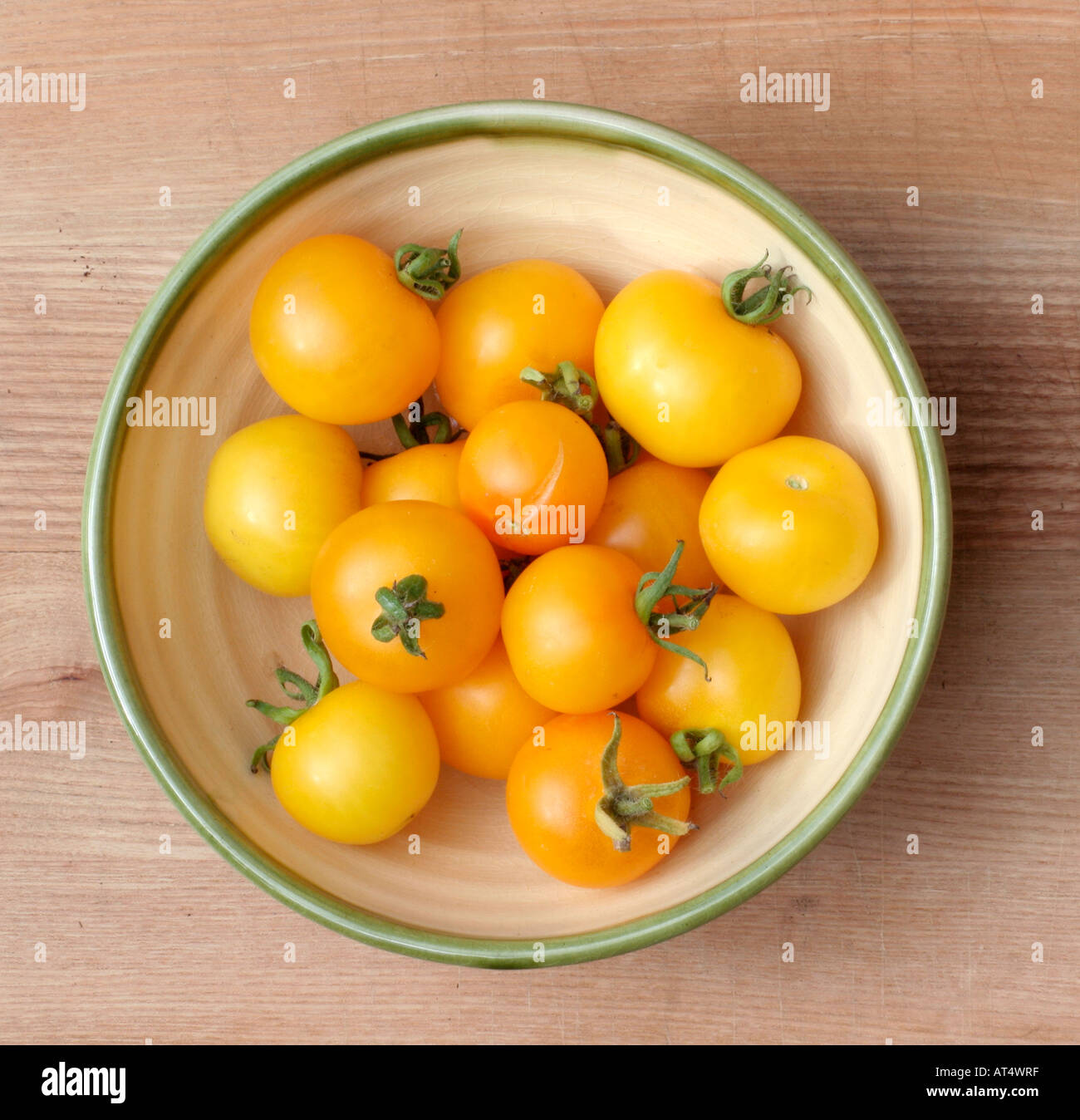 Tomato Golden Queen produces sweet soft skinned fruits Stock Photo - Alamy