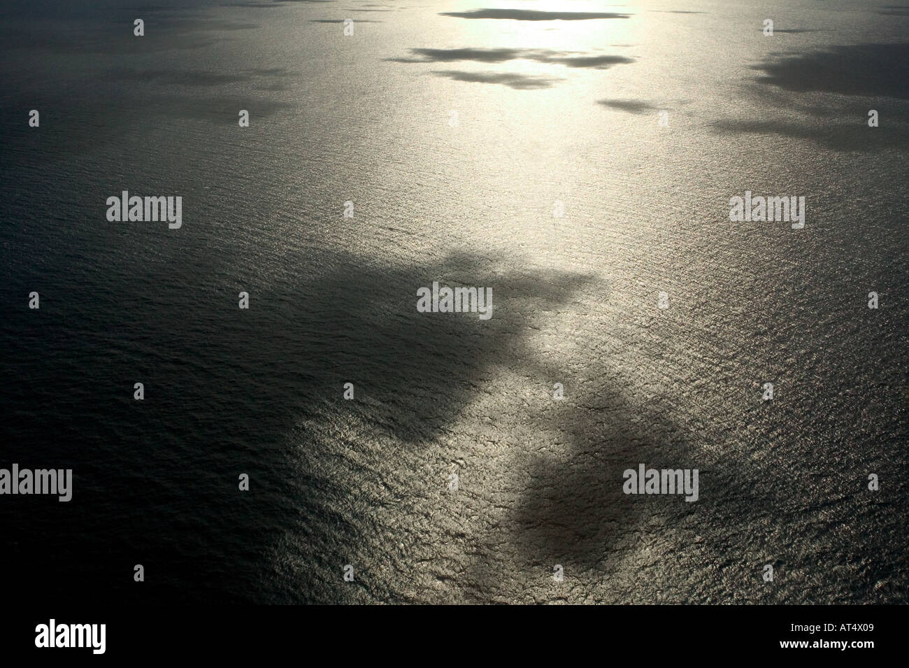 Water and clouds reflecting off ocean Stock Photo - Alamy