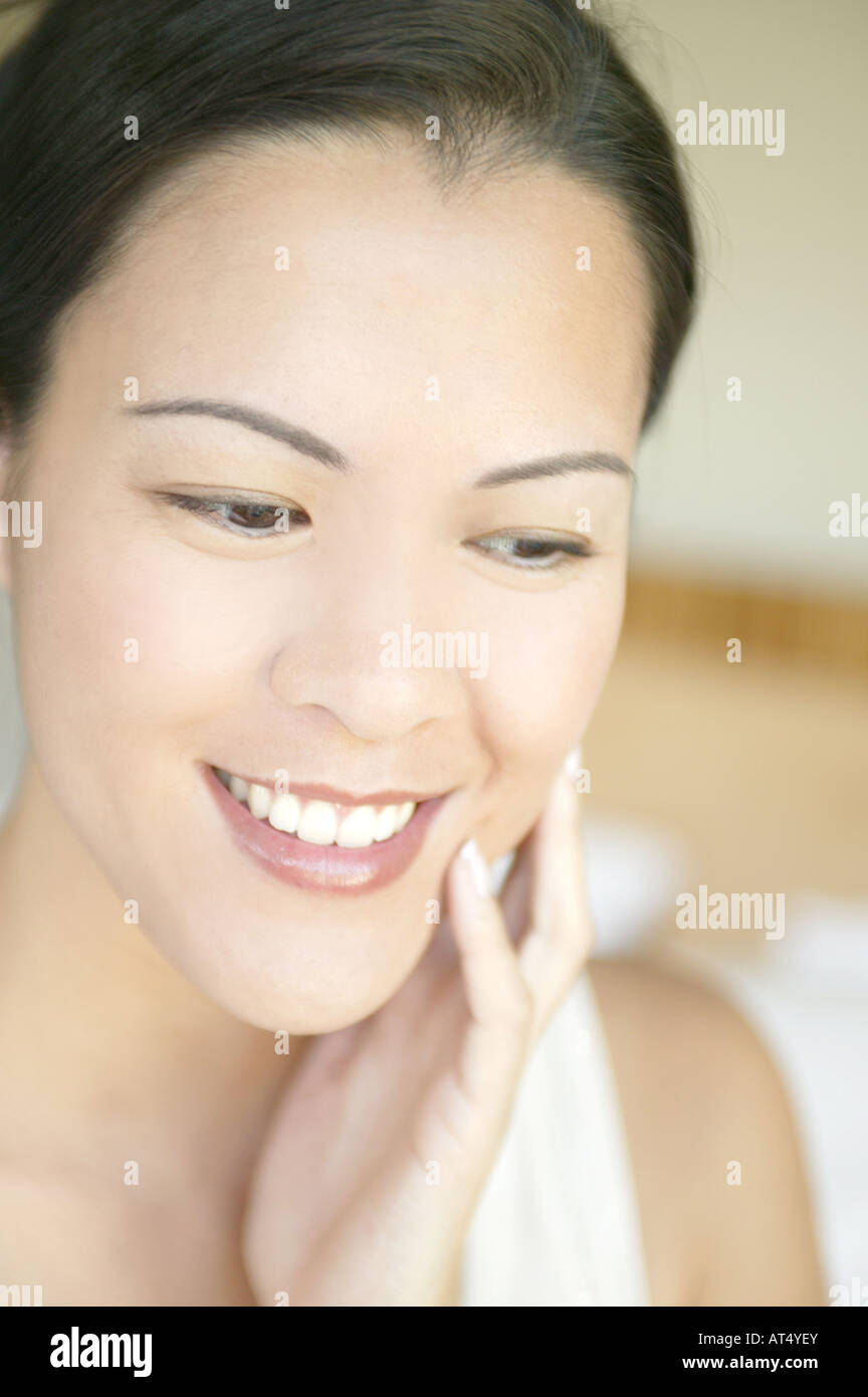 Woman Holding Hand to Face Stock Photo - Alamy