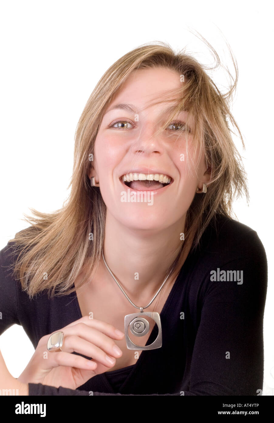cute young woman laughing with hairs motion on white background Stock ...