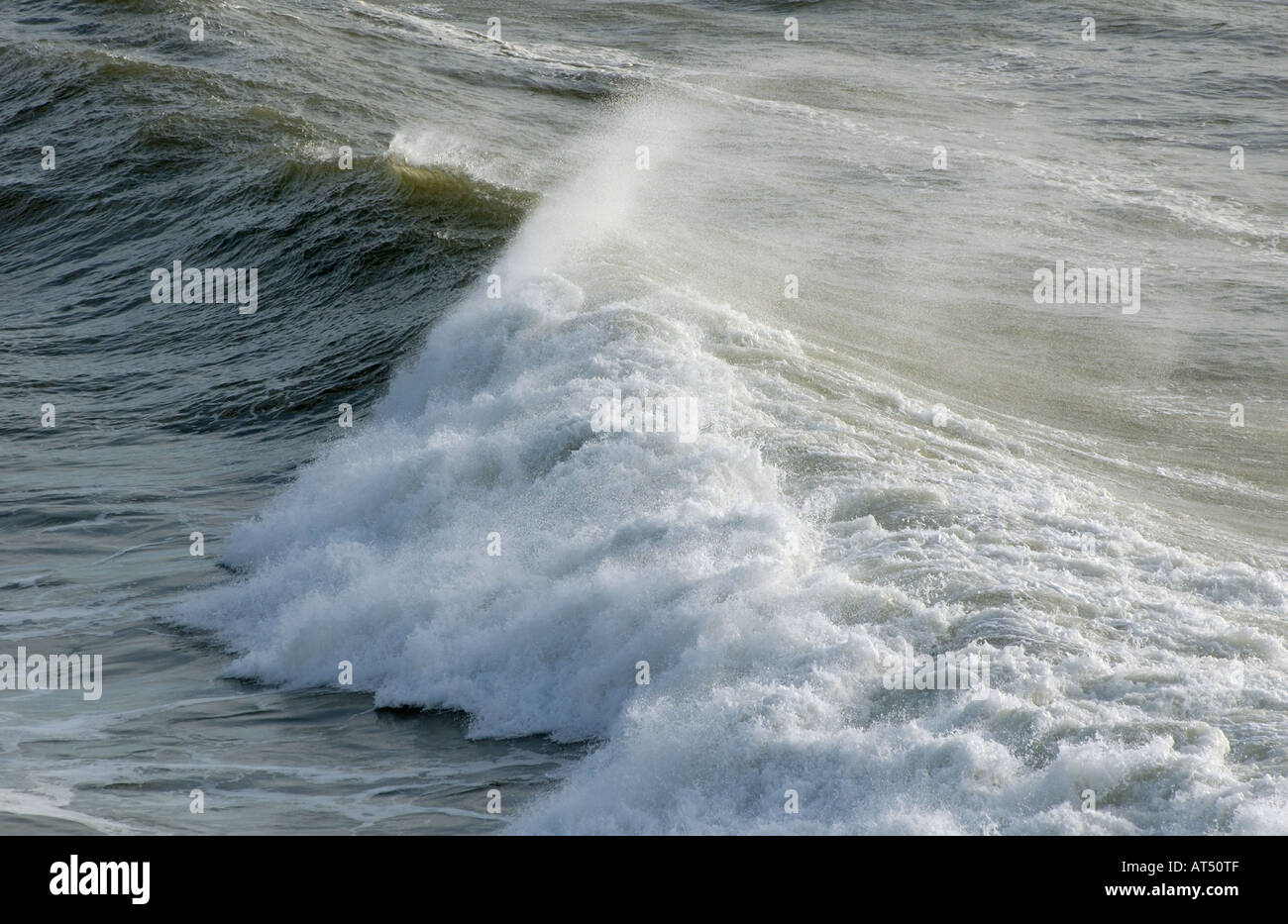 Wind blown wave Cornwall Stock Photo - Alamy