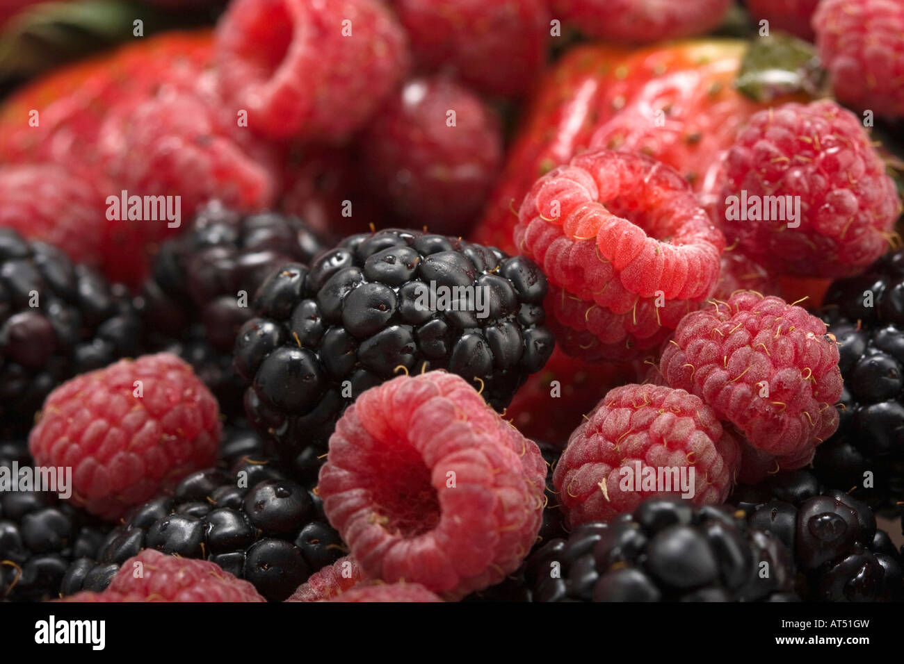Closeup of organic Strawberries Blackberries Raspberries fruits photo ...