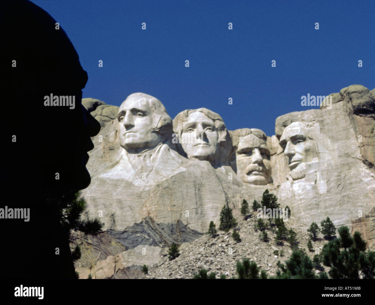 Statue of sculptor GUTZON BORGLUM silhouetted in front of MOUNT ...