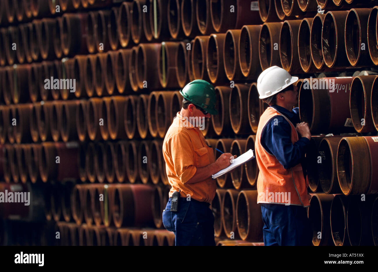 Workers checking [natural gas] pipes Stock Photo - Alamy
