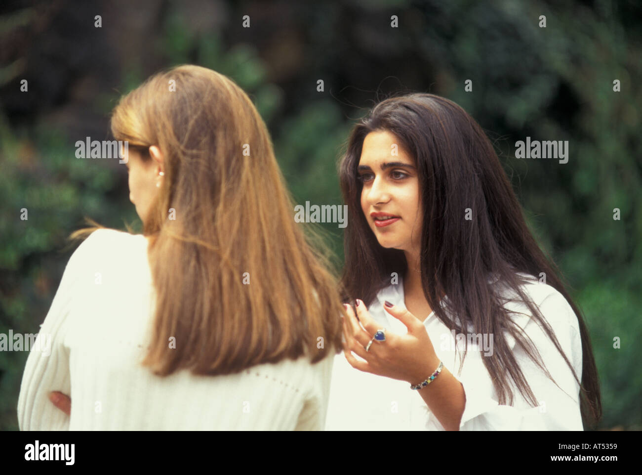 Teen girls have emotional discussion Stock Photo - Alamy