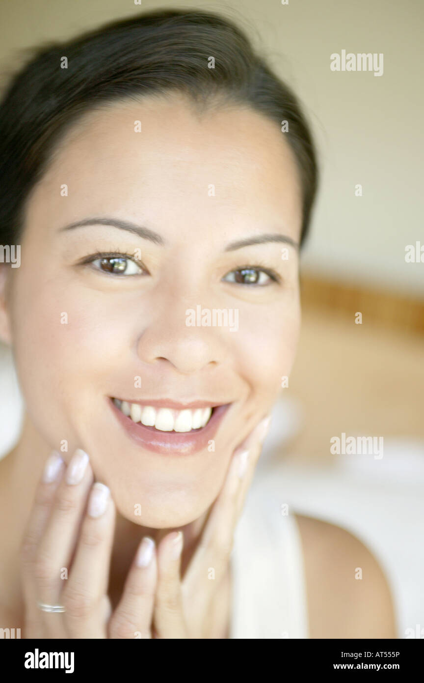 Woman Holding Hands to Face Stock Photo - Alamy