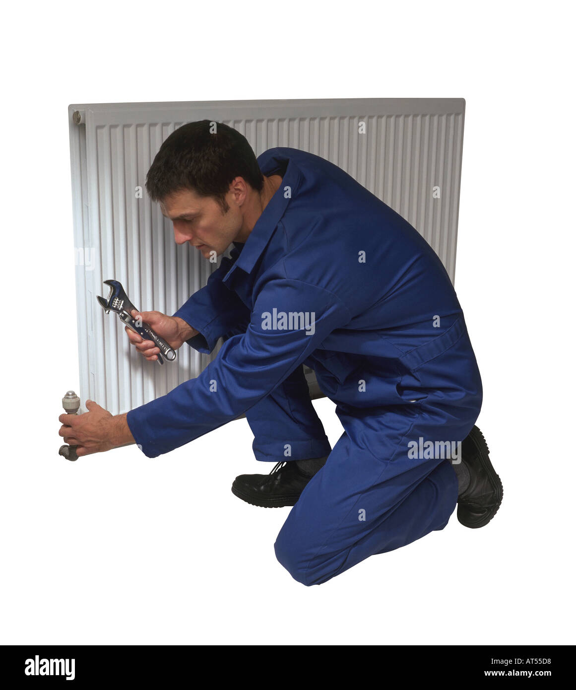 man fixing a domestic radiator Stock Photo - Alamy