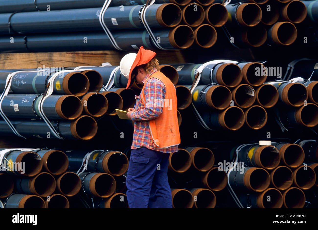 Workers checking [natural gas] pipes Stock Photo - Alamy